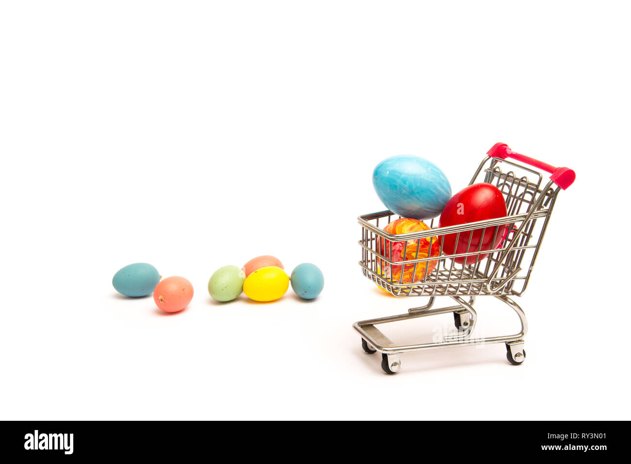 Easter shopping. Handmade colored eggs in cart. Business and selling in ...