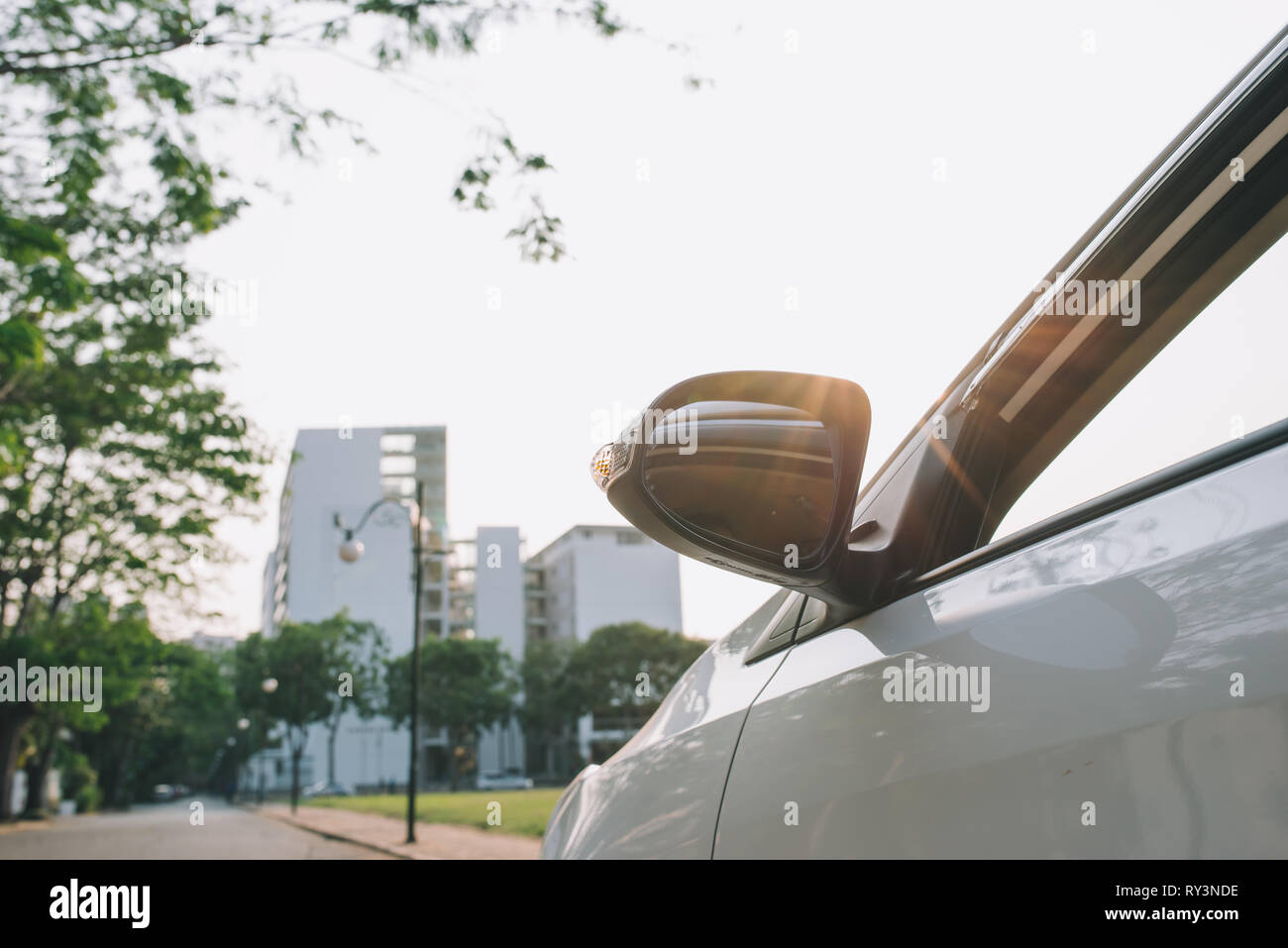 View from back side of new white car parking on the asphalt road in ...