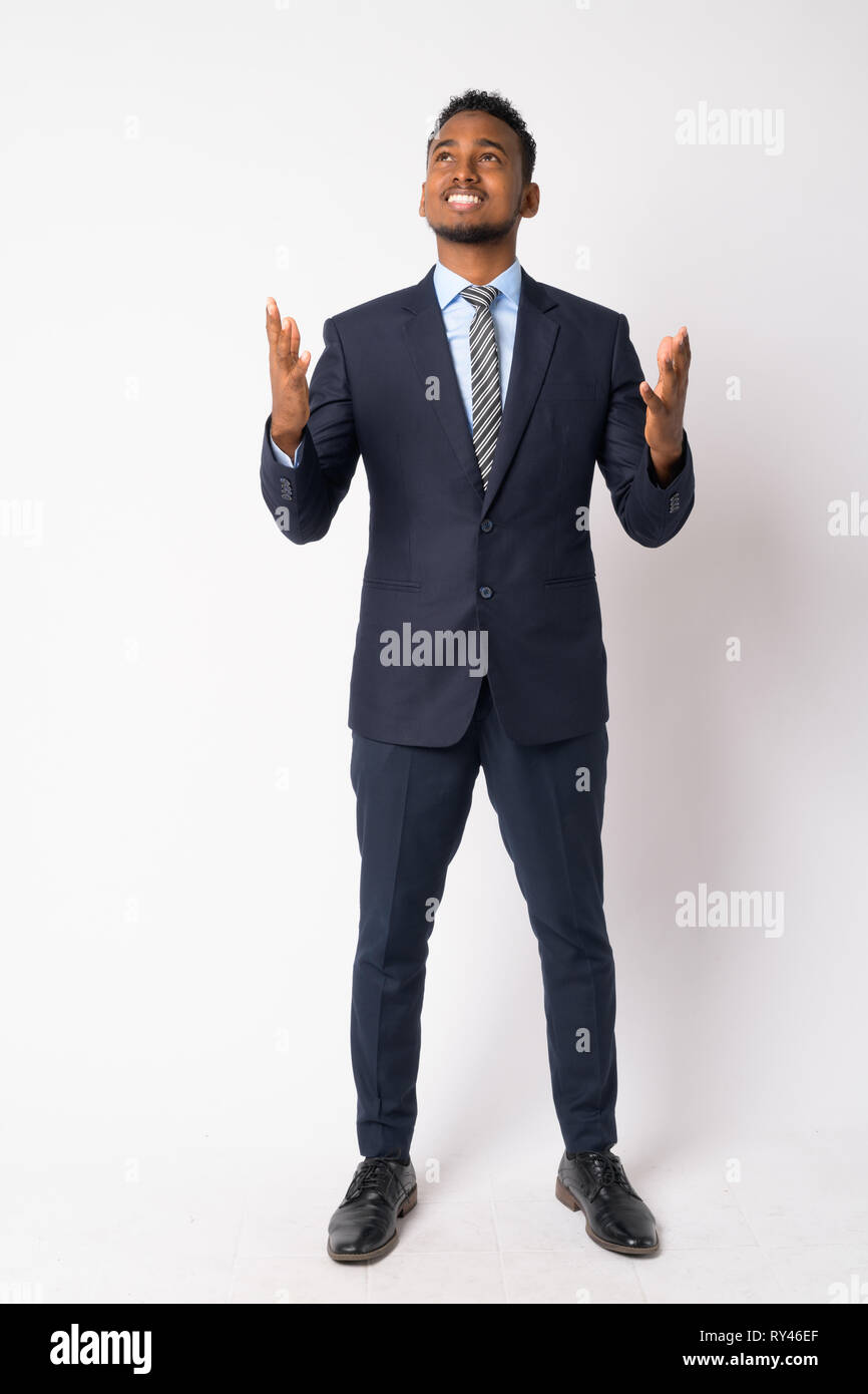 Happy young african businessman catching hi-res stock photography and ...