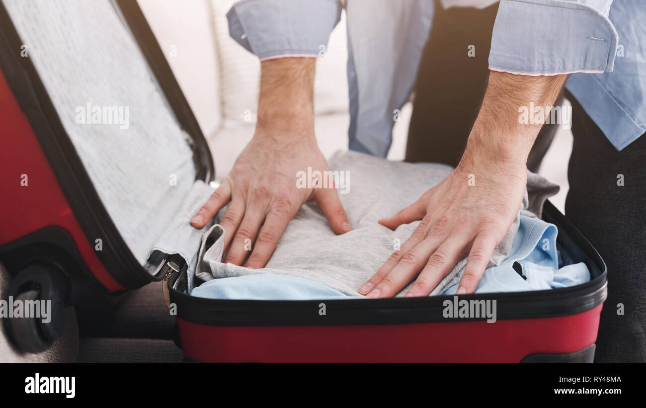 Packing bag clothes hi-res stock photography and images - Alamy
