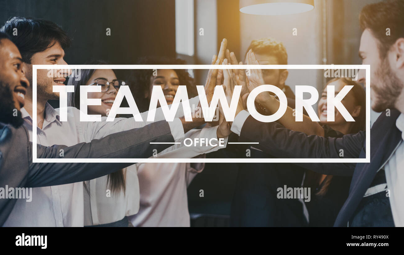 Teamwork concept. Colleagues giving high five in office Stock Photo - Alamy