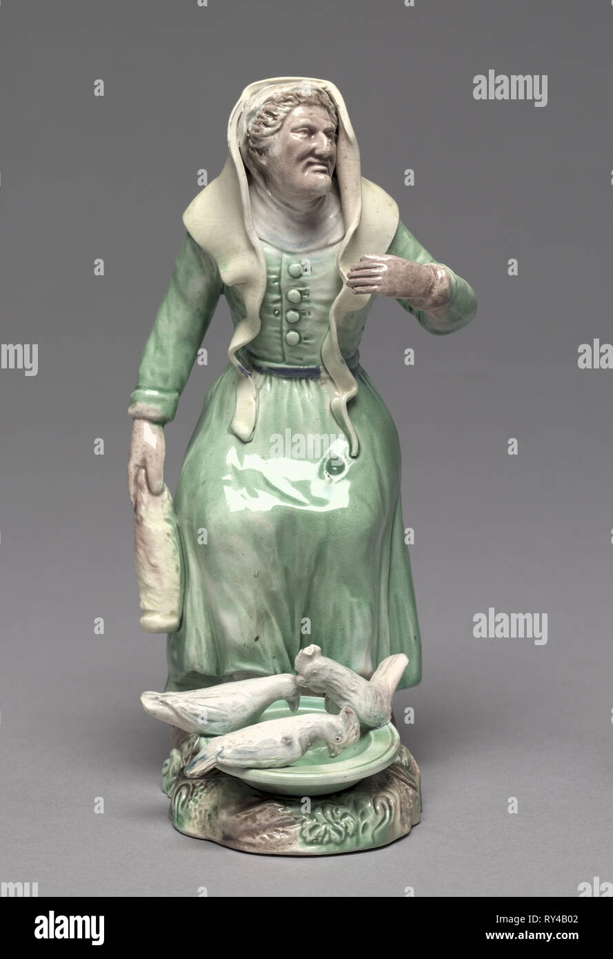 Old woman feeding chickens hi-res stock photography and images - Alamy