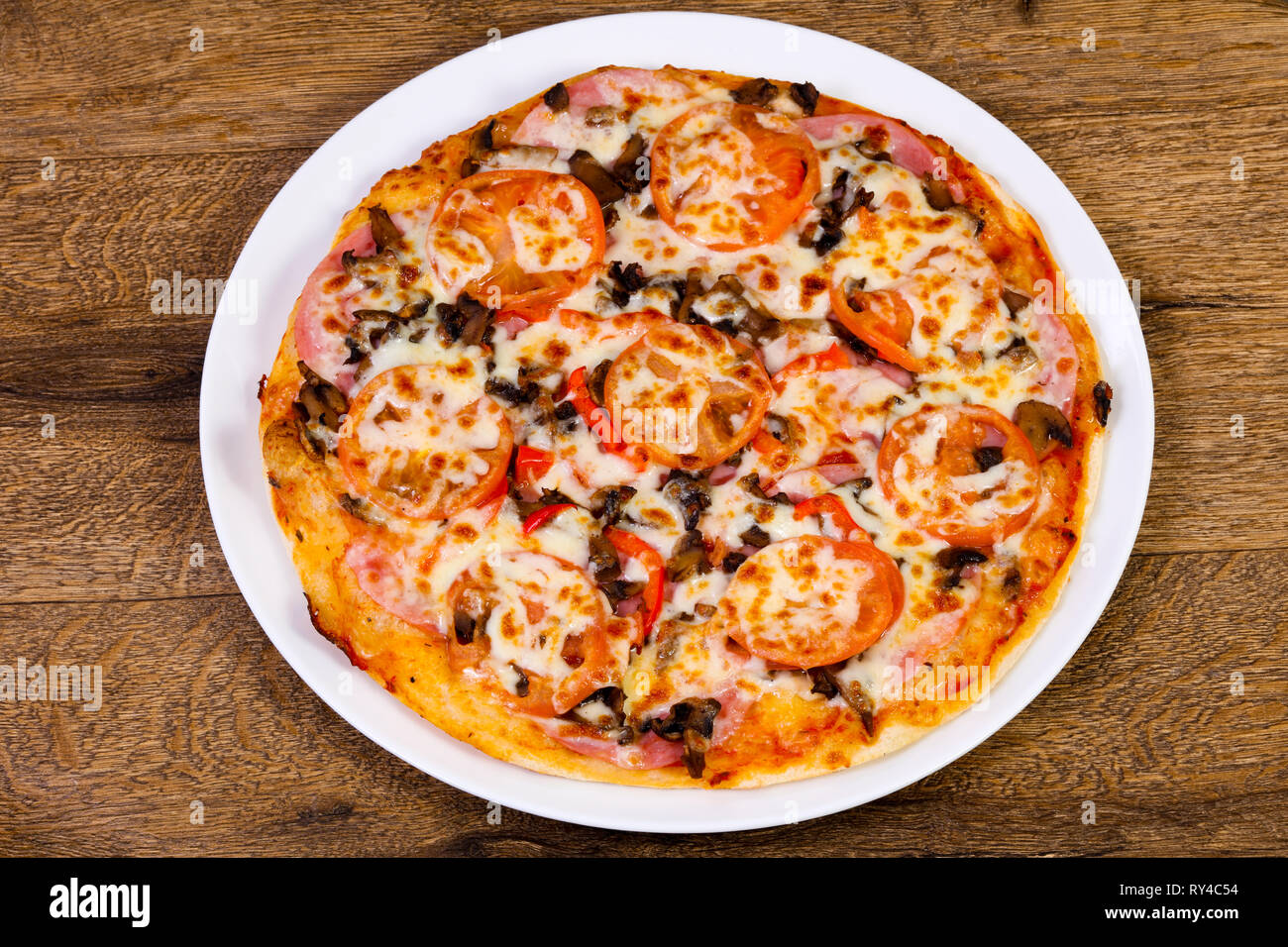 Pizza with ham and cheese Stock Photo - Alamy