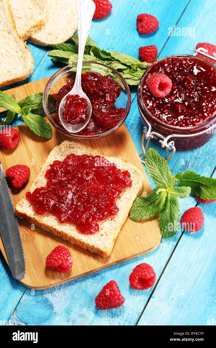 Toast bread with homemade raspberry jam or marmalade on rustic blue ...