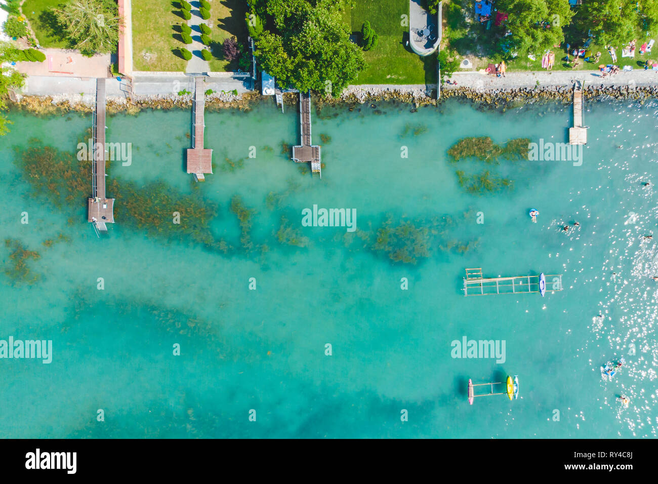 aerial view of the shore with building. back yards with piers. overhead ...