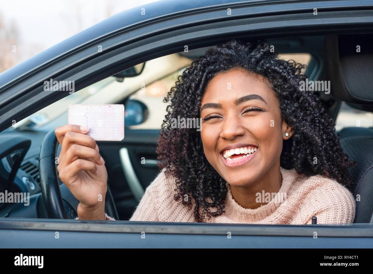 Happy young black woman hi-res stock photography and images - Alamy