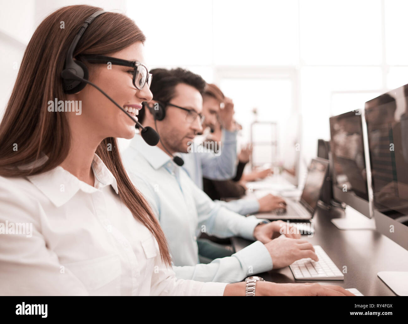 young colleagues work in the call center Stock Photo - Alamy