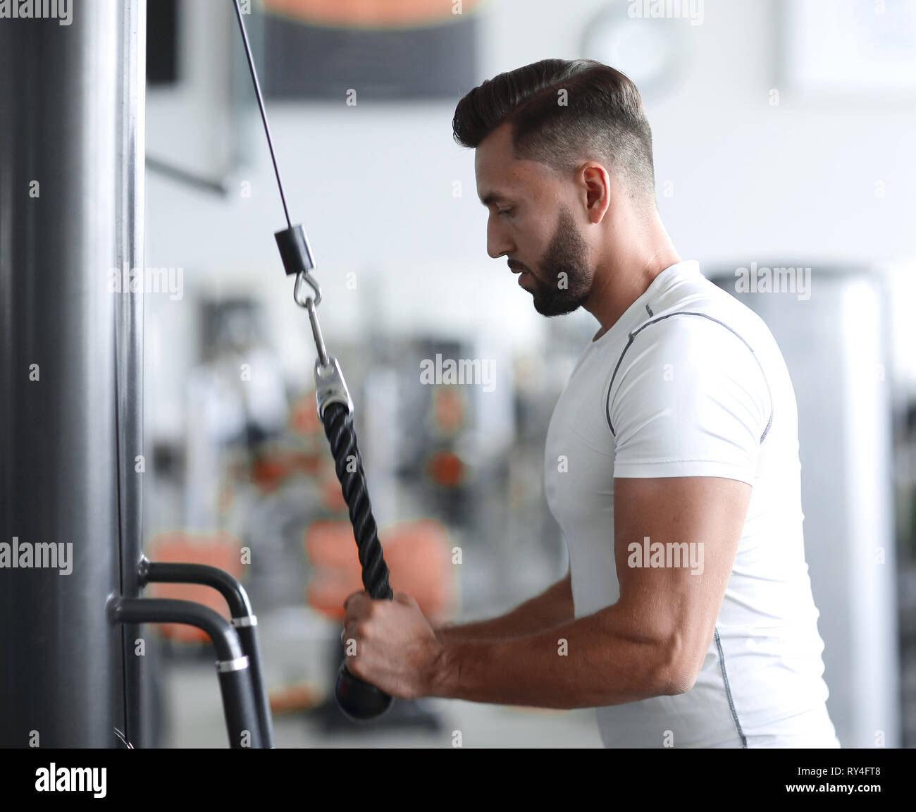 close up.attractive man performing strength exercises Stock Photo - Alamy