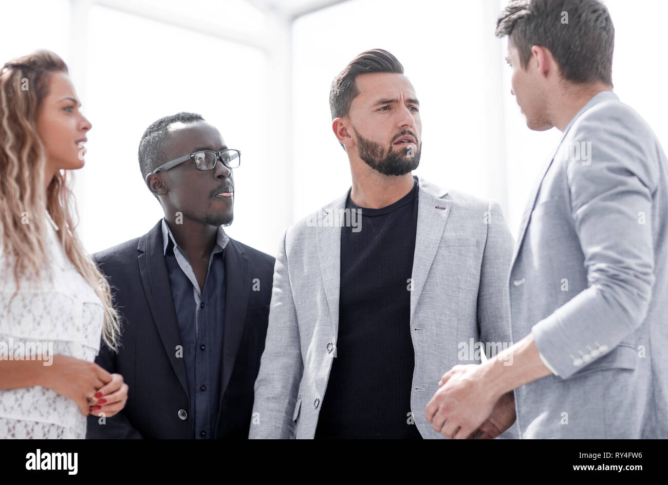 Manager talking with young employees Stock Photo - Alamy