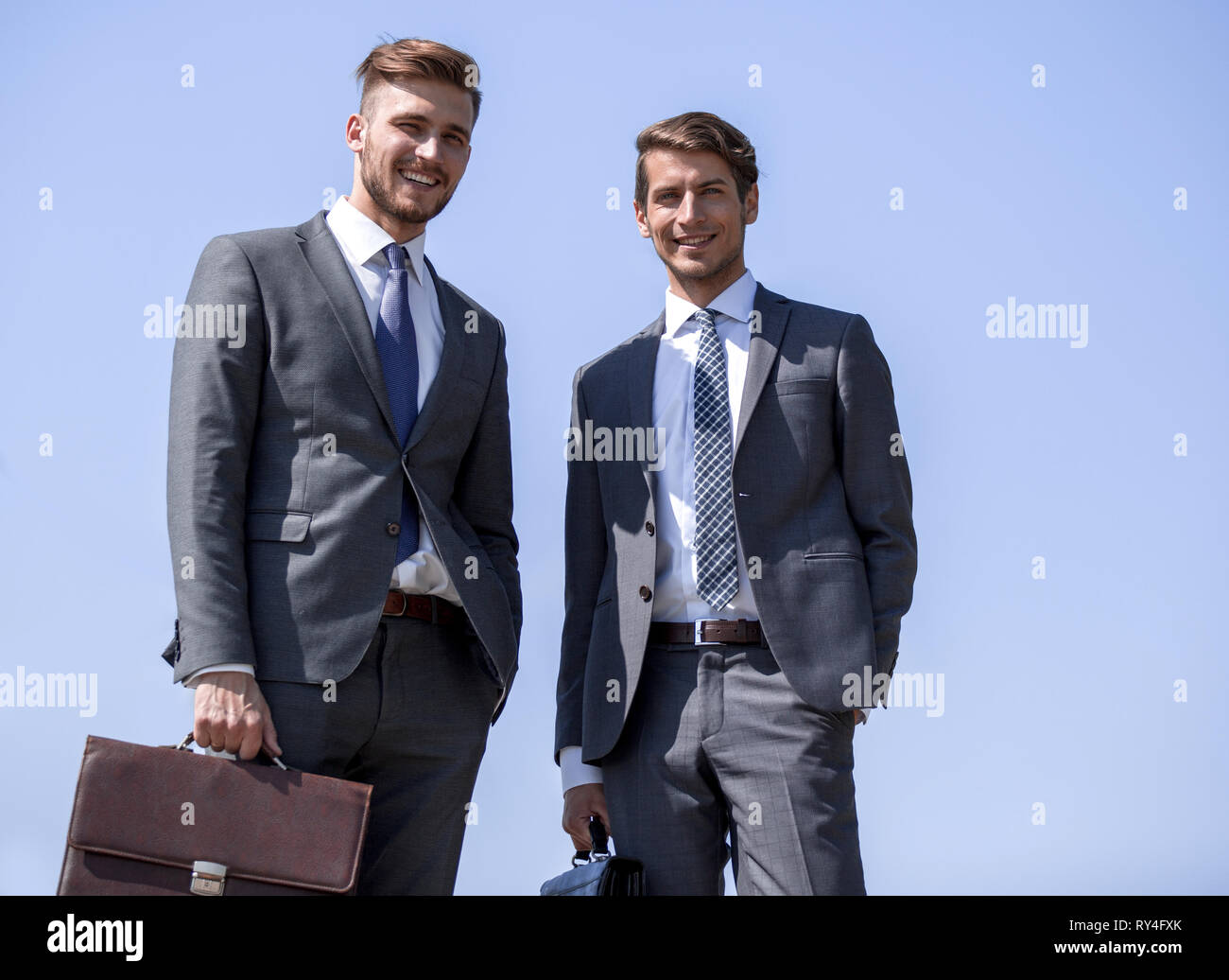 two business people standing together Stock Photo - Alamy
