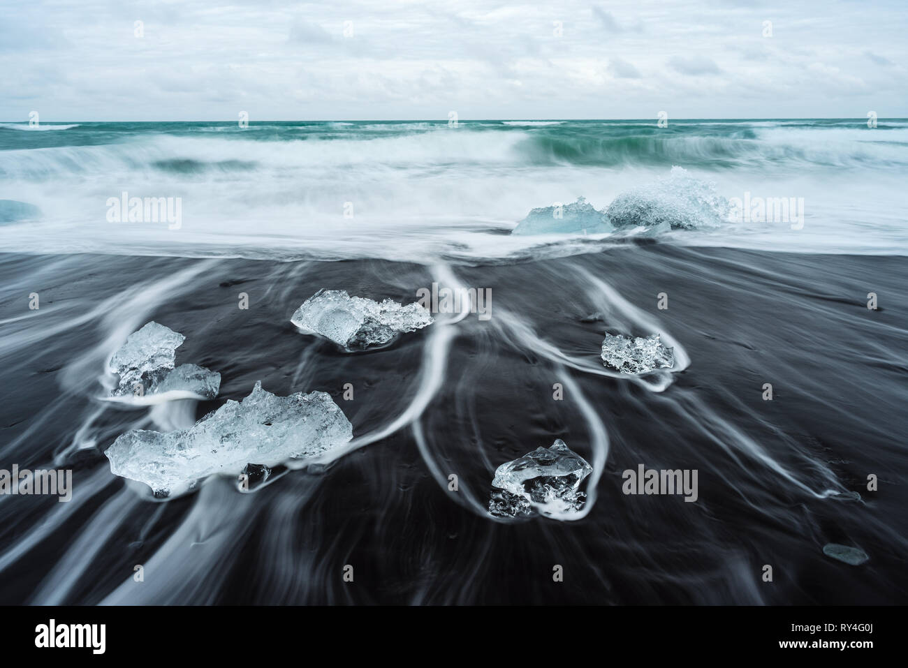 Icy beach in Iceland, Europe. Iceberg on the black volcanic sand on the ...