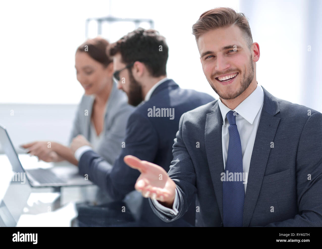 side view.successful businessman reaching out for a handshake Stock ...