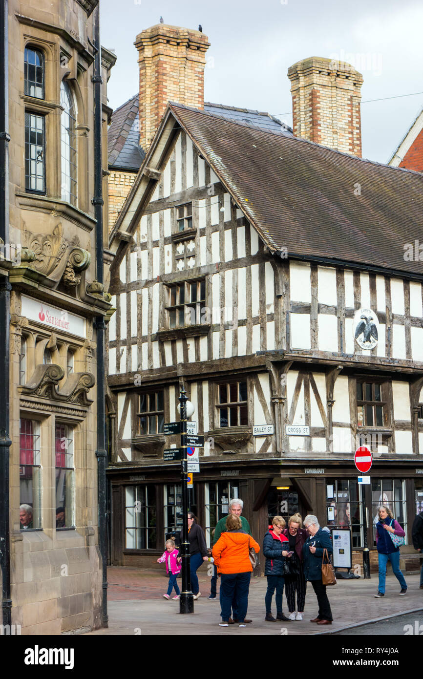 people shoppers shopping on the high Street in the Shropshire market ...