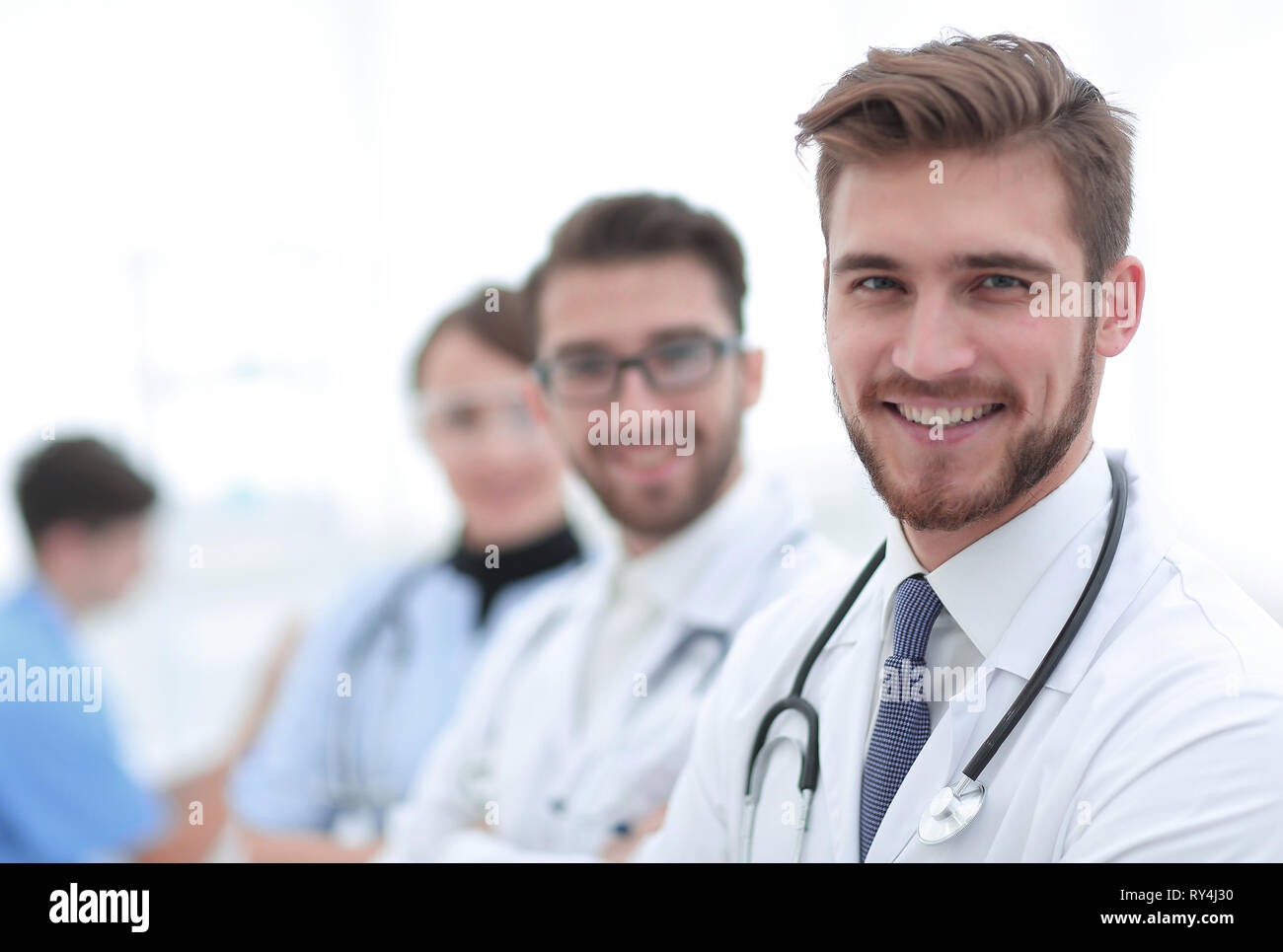 Portrait of friendly male doctor smiling Stock Photo - Alamy