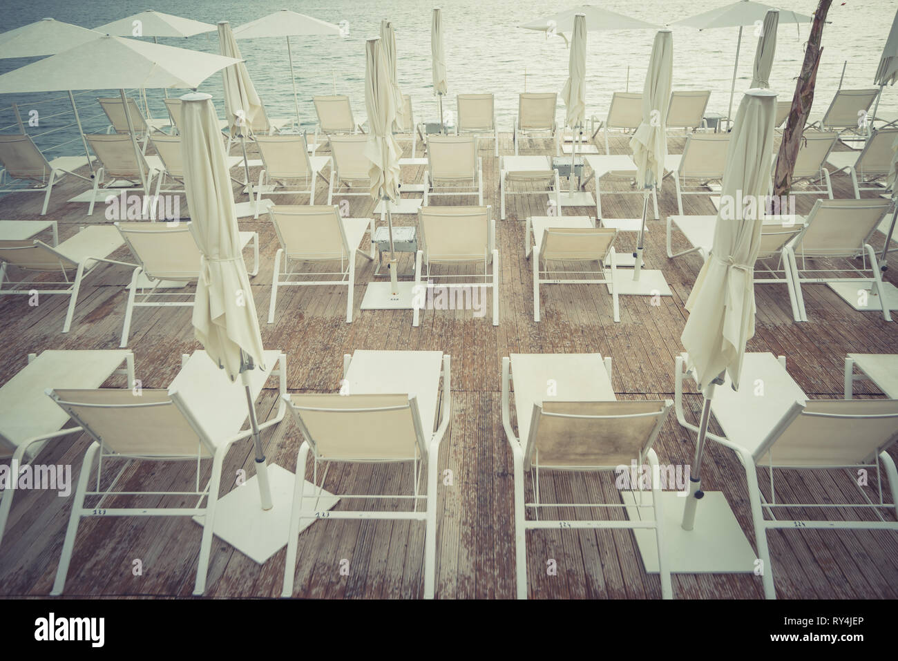 Overview of a beautiful solarium facing the sea on a hot summer day ...
