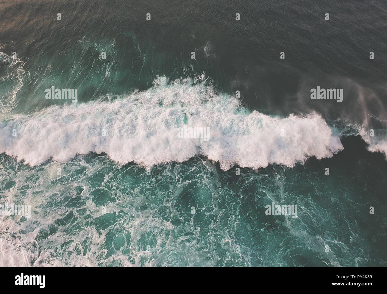 Aerial top view of ocean wave with foam. Drone Photo Stock Photo - Alamy