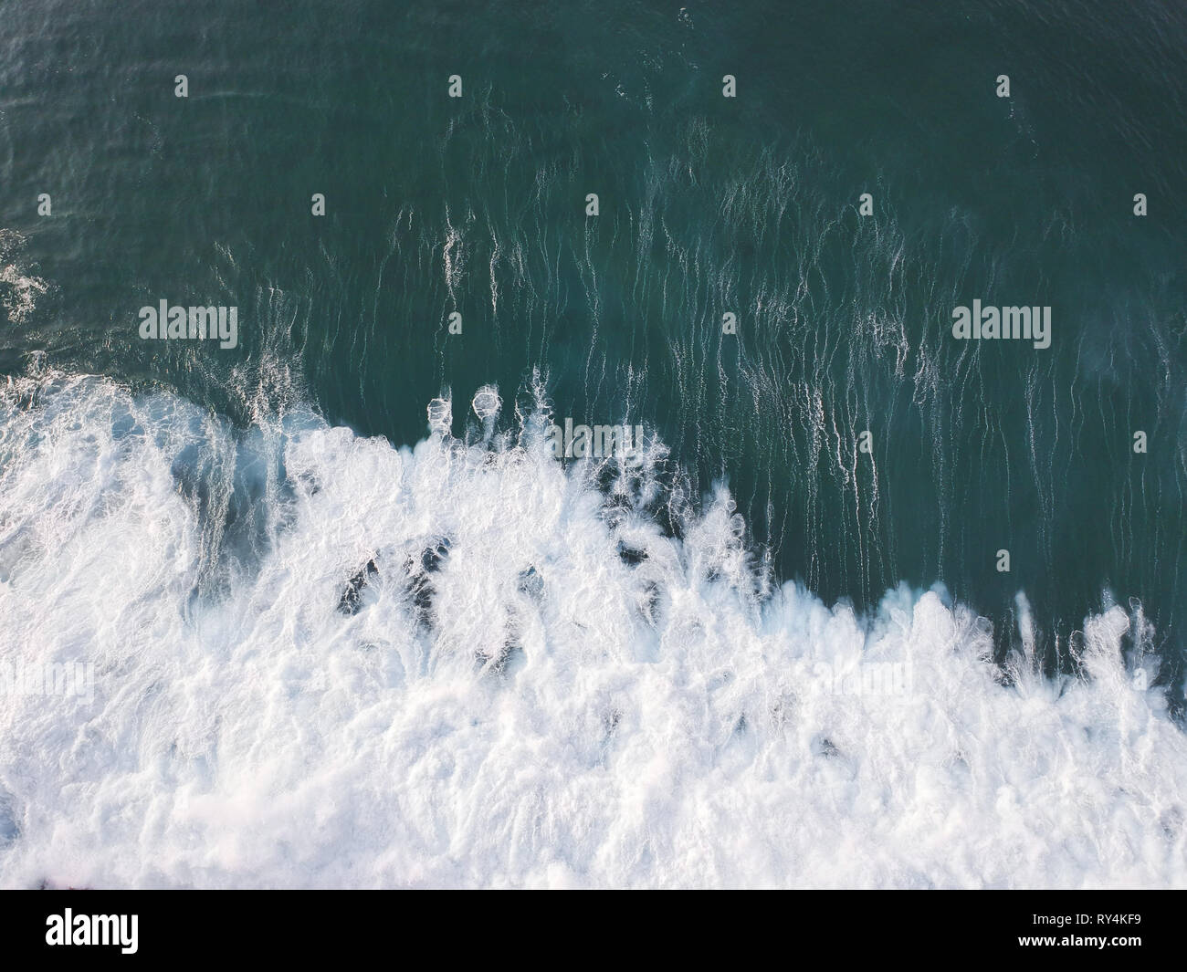 Aerial top view of ocean wave with foam. Drone Photo Stock Photo - Alamy