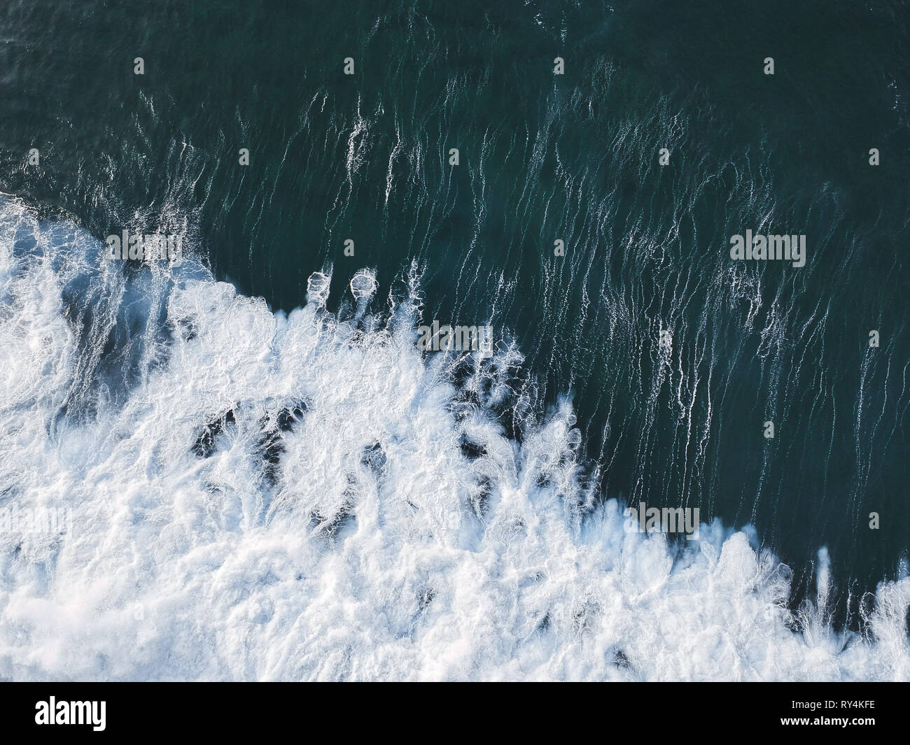 Aerial top view of ocean wave with foam. Drone Photo Stock Photo - Alamy