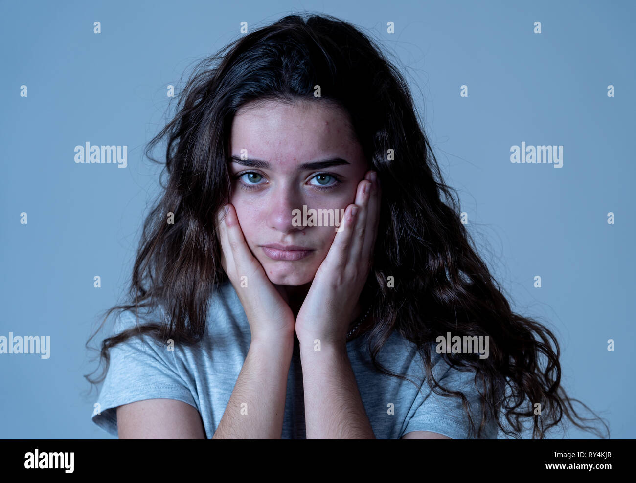 Portrait of beautiful sad miserable young teenager girl with unhappy ...