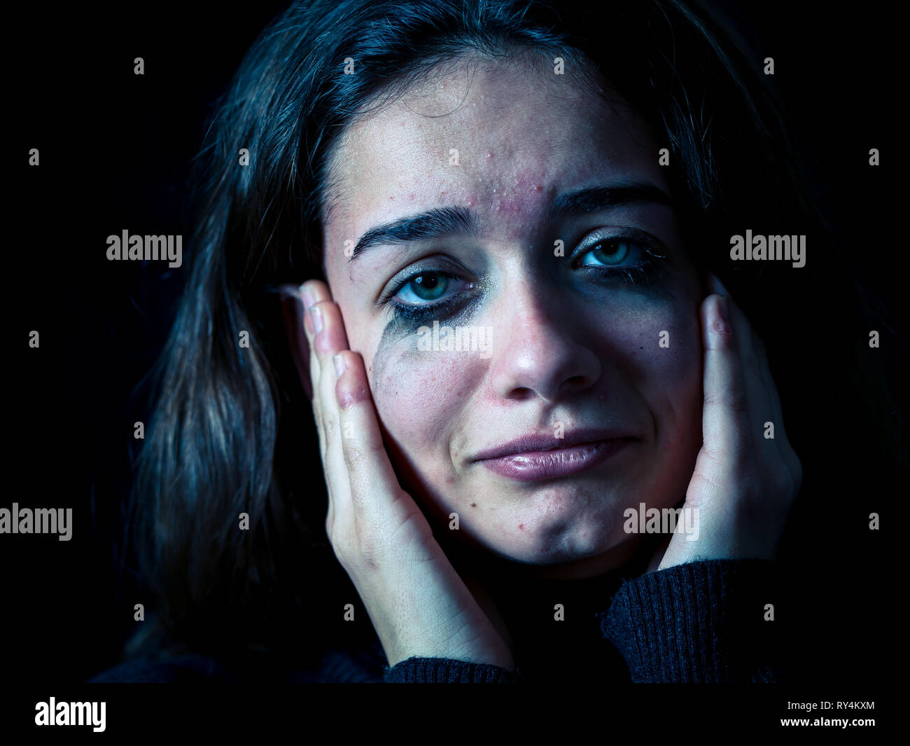 Dramatic closeup portrait of young scared, depressed girl crying alone ...