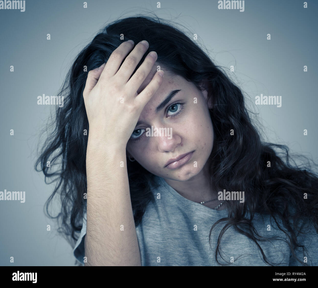 Portrait of sad young teen girl feeling unhappy, miserable and ...