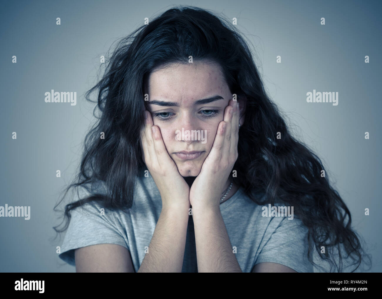 Portrait of beautiful sad miserable young teenager girl with unhappy ...