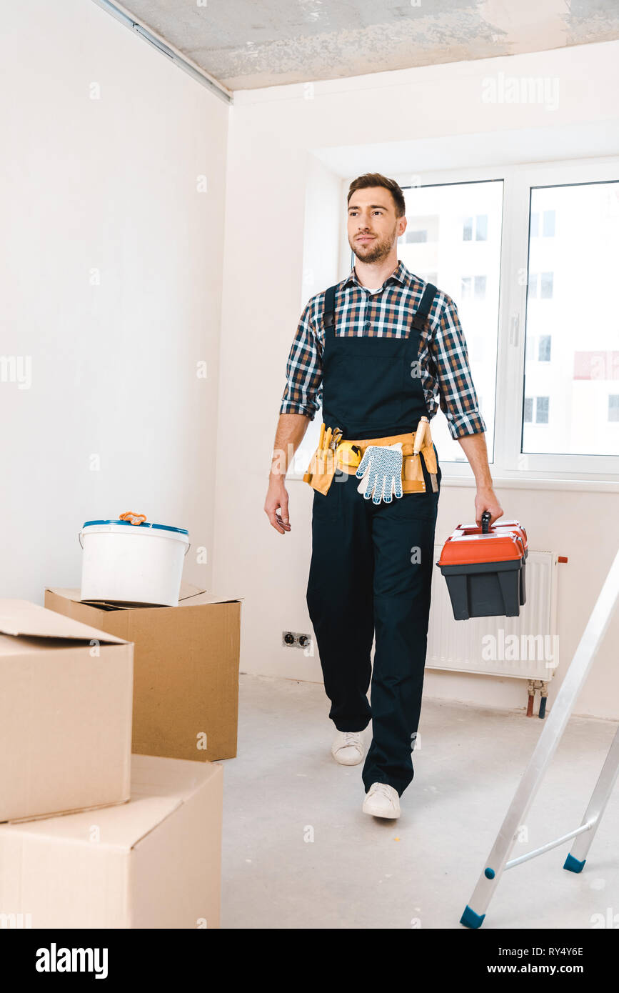 Handsome handyman holding boxes hi-res stock photography and images - Alamy