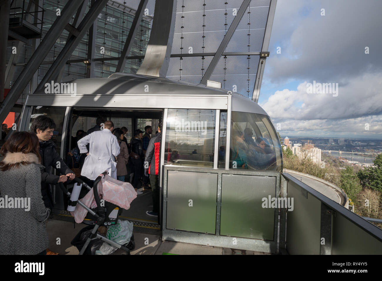 Commuters boarding Portland Aerial Tram at OHSU, Portland, Oregon Stock ...