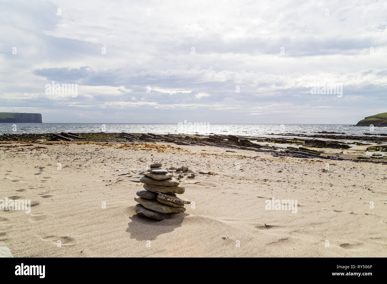 Orkney Islands. Scotland. UK. Rocks stacked on a beach by the Sound of ...