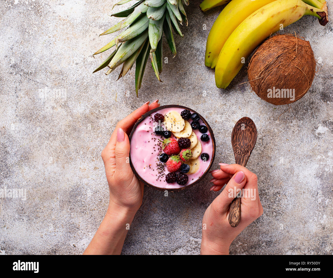 Acai bowl in coconut plate Stock Photo - Alamy