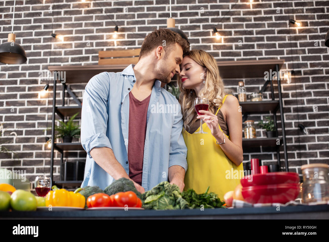 Curly woman feeling extremely happy with her supportive man Stock Photo ...