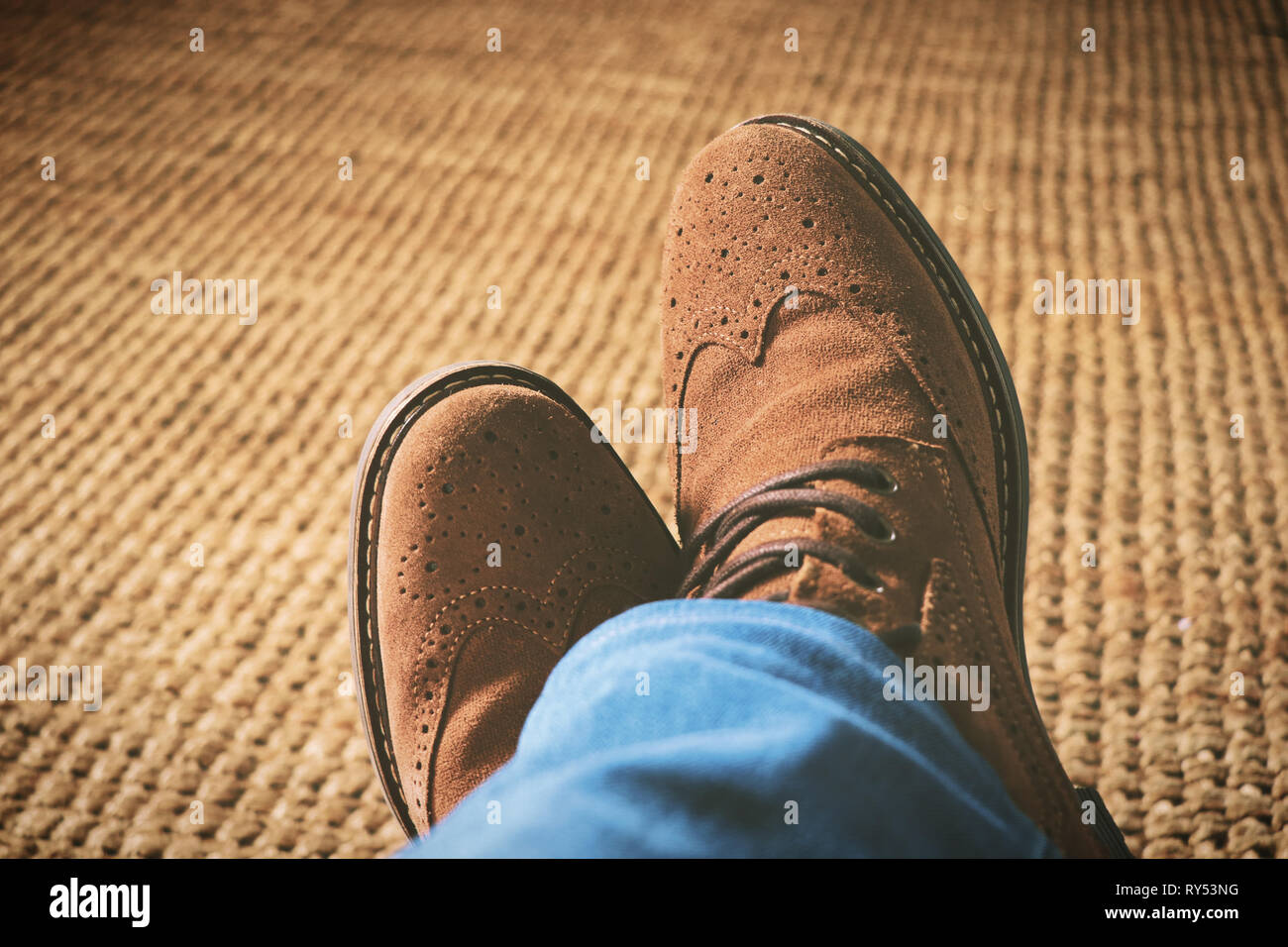 Top view from man with brown leather shoes and jeans Stock Photo - Alamy