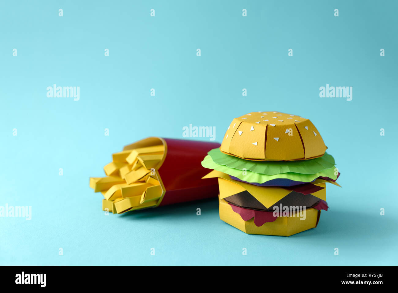 Paper cheeseburger with beef, cheese, tomato, lettuce, onion, bacon and ...