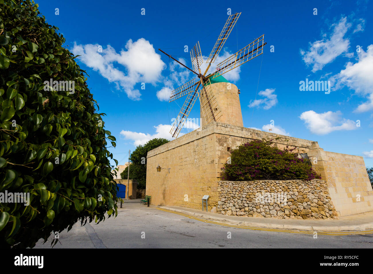 Old sandstone windmill on Gozo island. Historical architecture of Malta ...