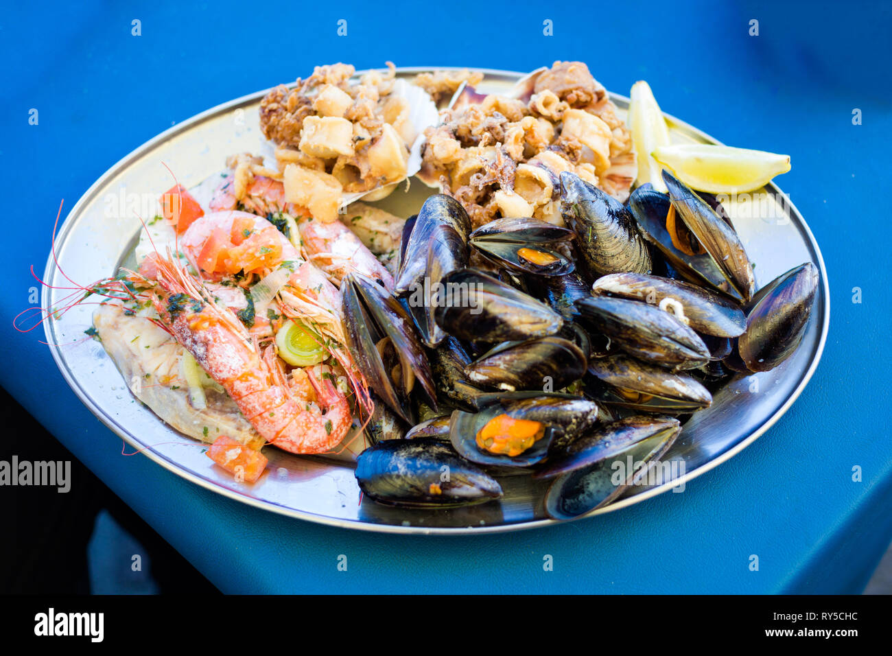 Traditional maltese fish and seafood platter set mix of calamari rings ...