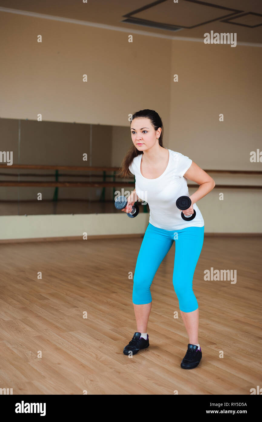 Fitness model doing bodybuilding workout with weights Stock Photo - Alamy