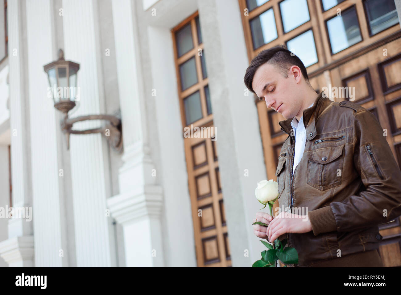 Portrait of a young man in love who is waiting for his girlfriend Stock ...