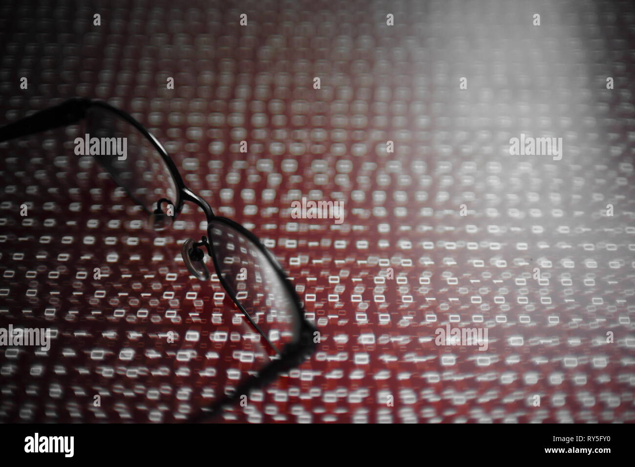 computer hacker. red dangerous code breach into red binary code with ...