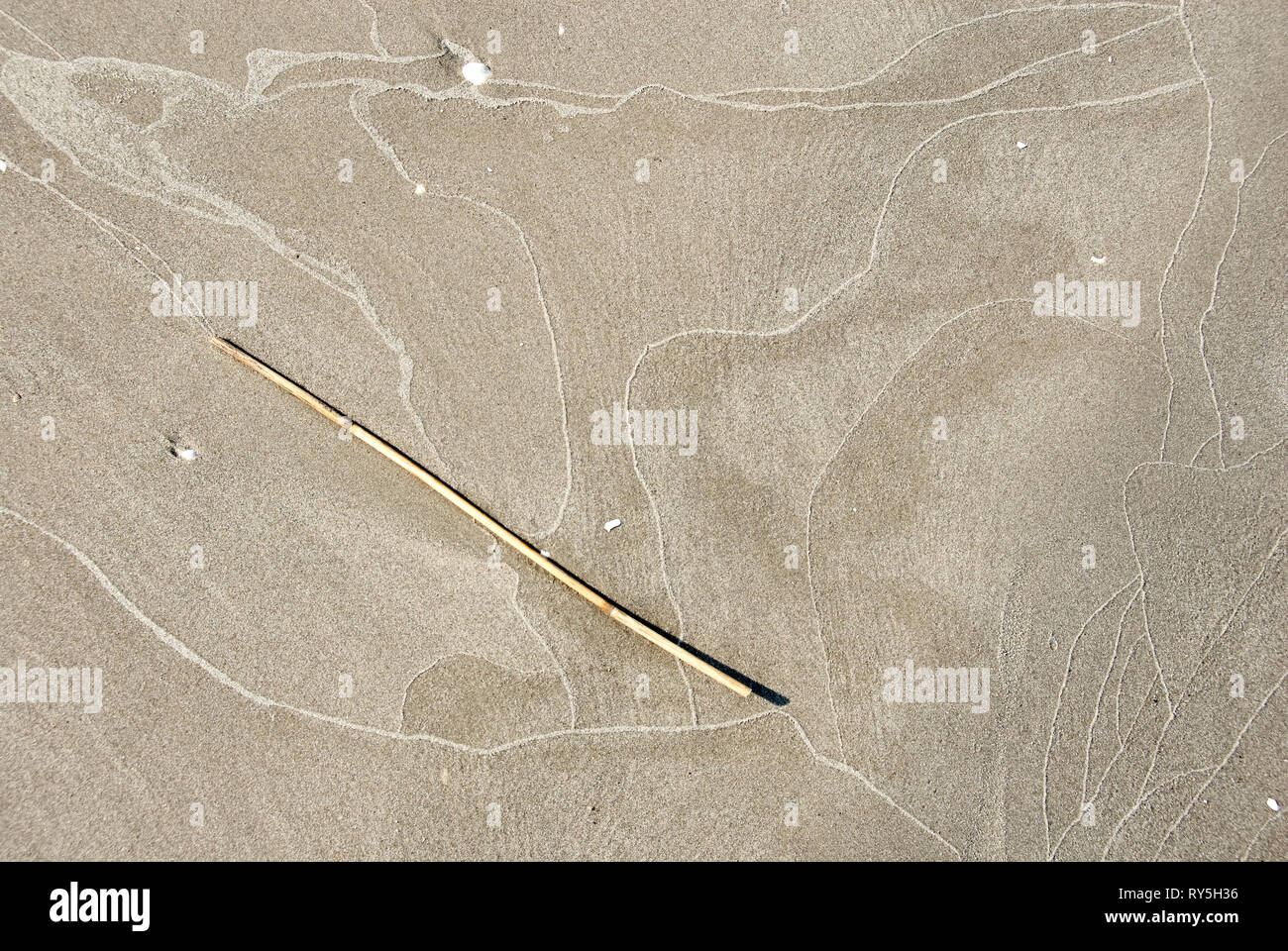 sand at shoreline with structures Stock Photo - Alamy