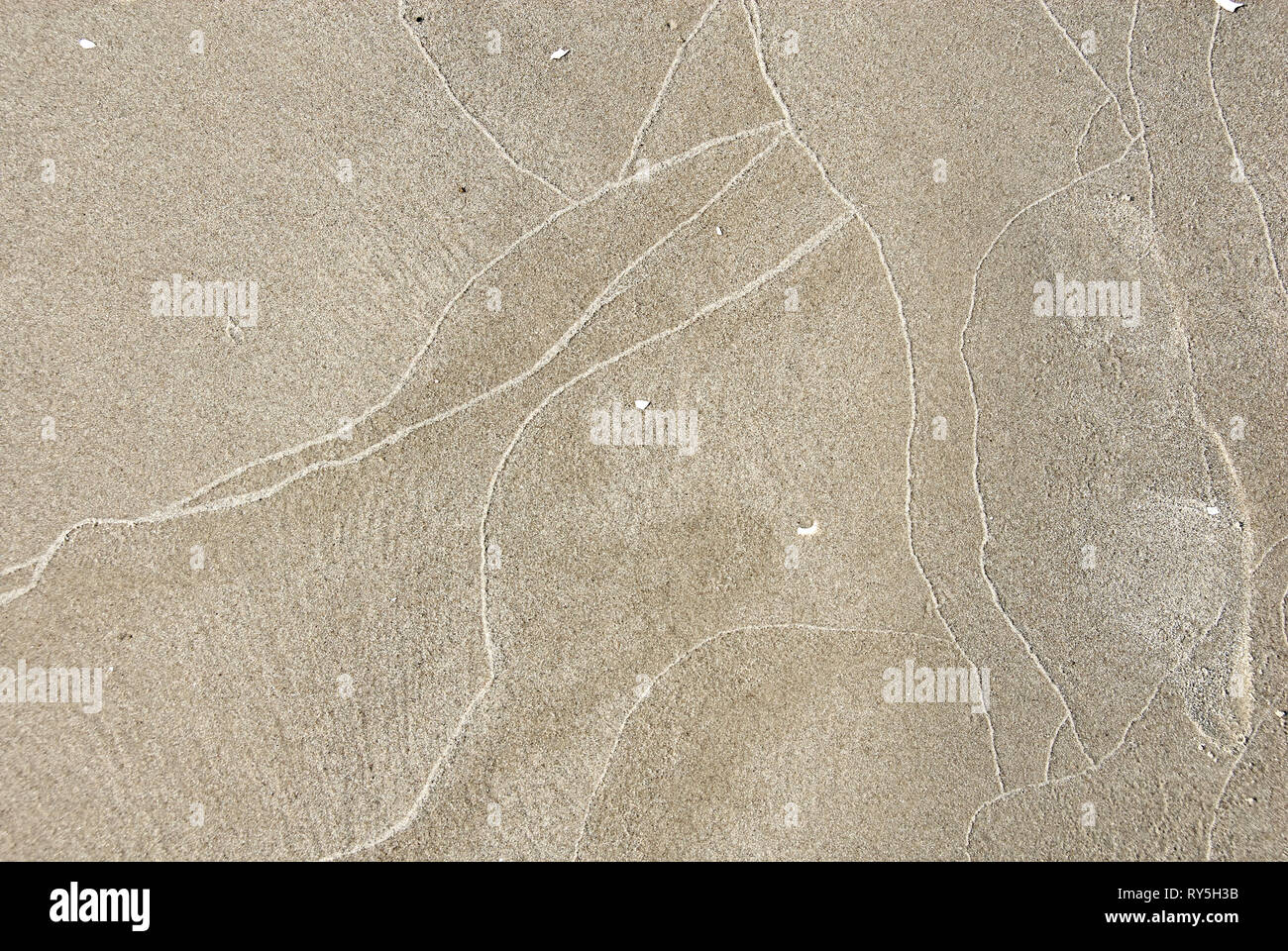 sand at shoreline with structures Stock Photo - Alamy