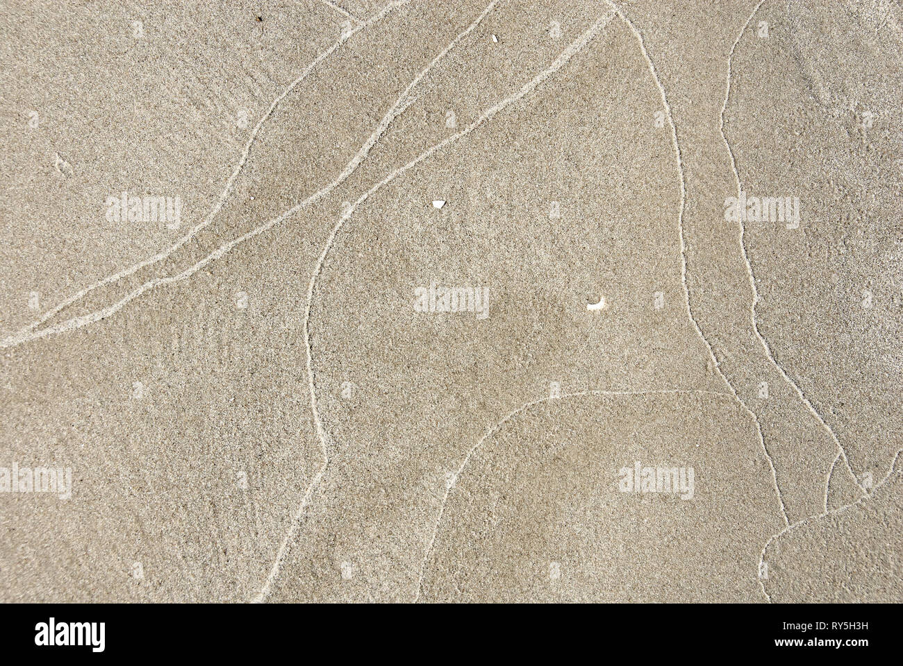 sand at shoreline with structures Stock Photo - Alamy