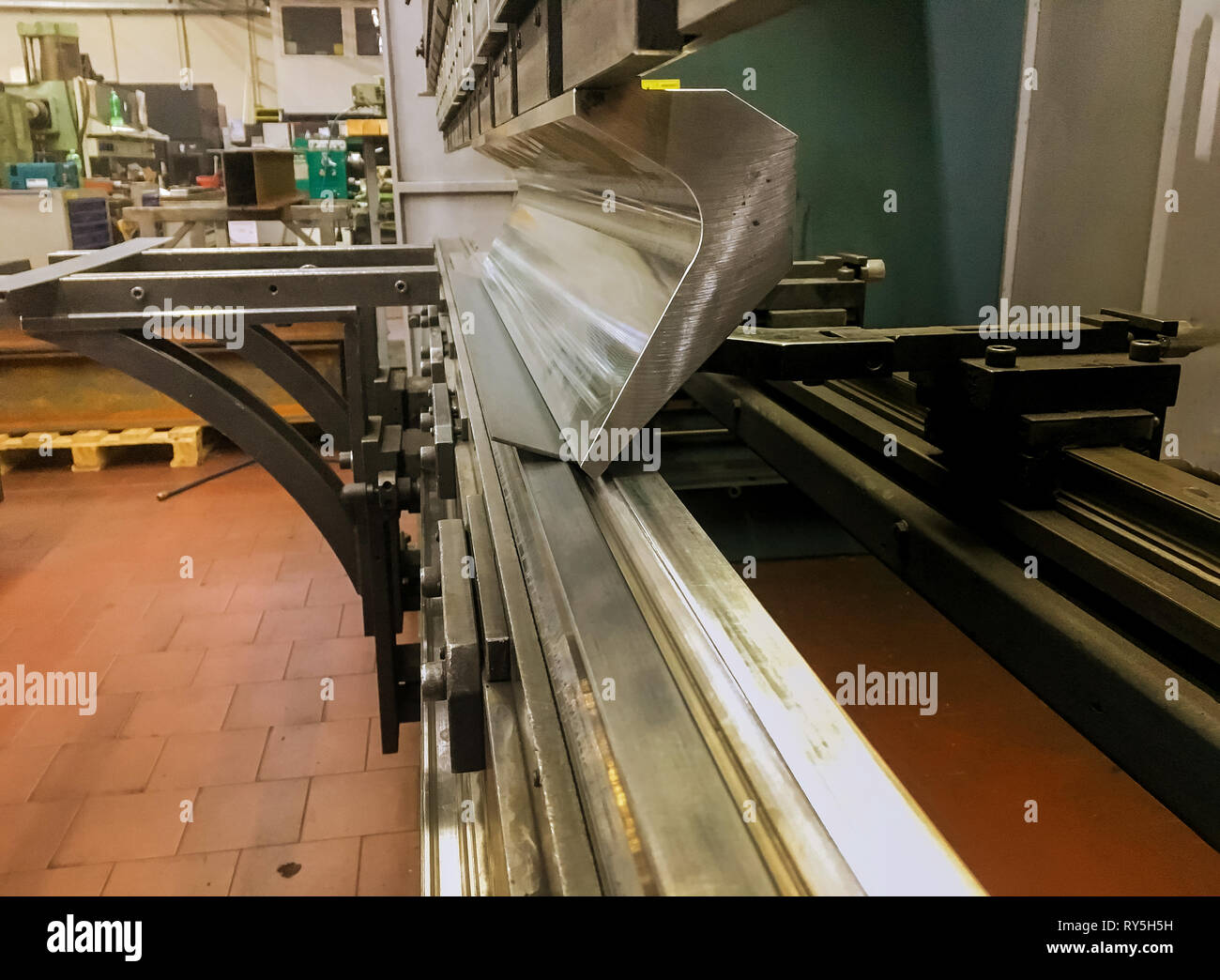 Sheet metal bending in factory Stock Photo - Alamy