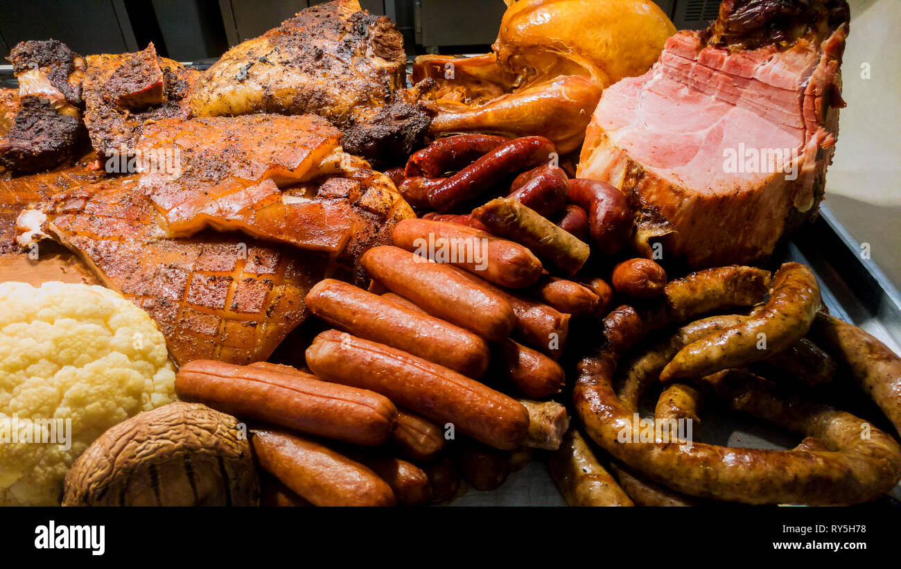 Assorted food set with dishes grilled meat kebab pork ribs and sausages ...