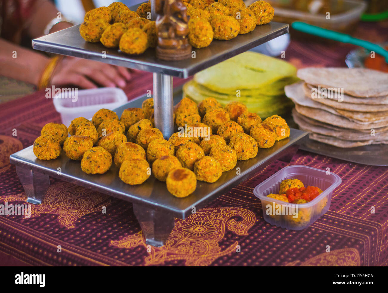 Food market stand with vegan indian food Stock Photo - Alamy