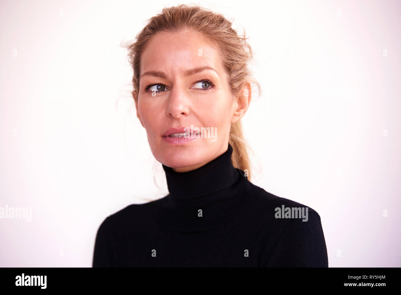 Close-up portrait shot of mature woman with beautiful face standing at ... Close-up portrait shot of mature woman with beautiful face standing at ...