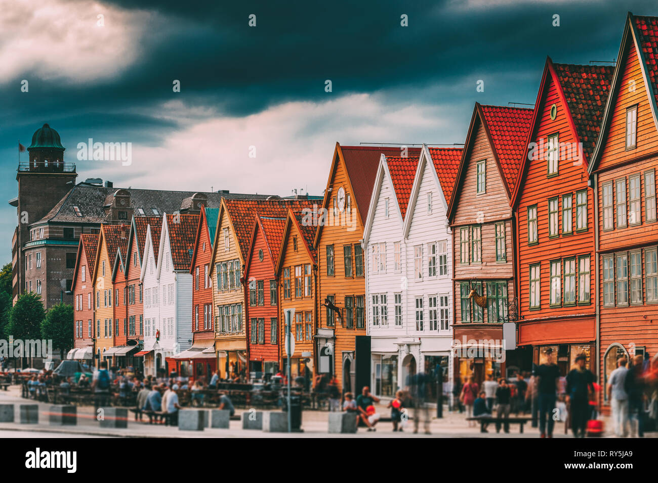 Bergen, Norway. Tourists People Visiting Historical Landmark Houses In ...
