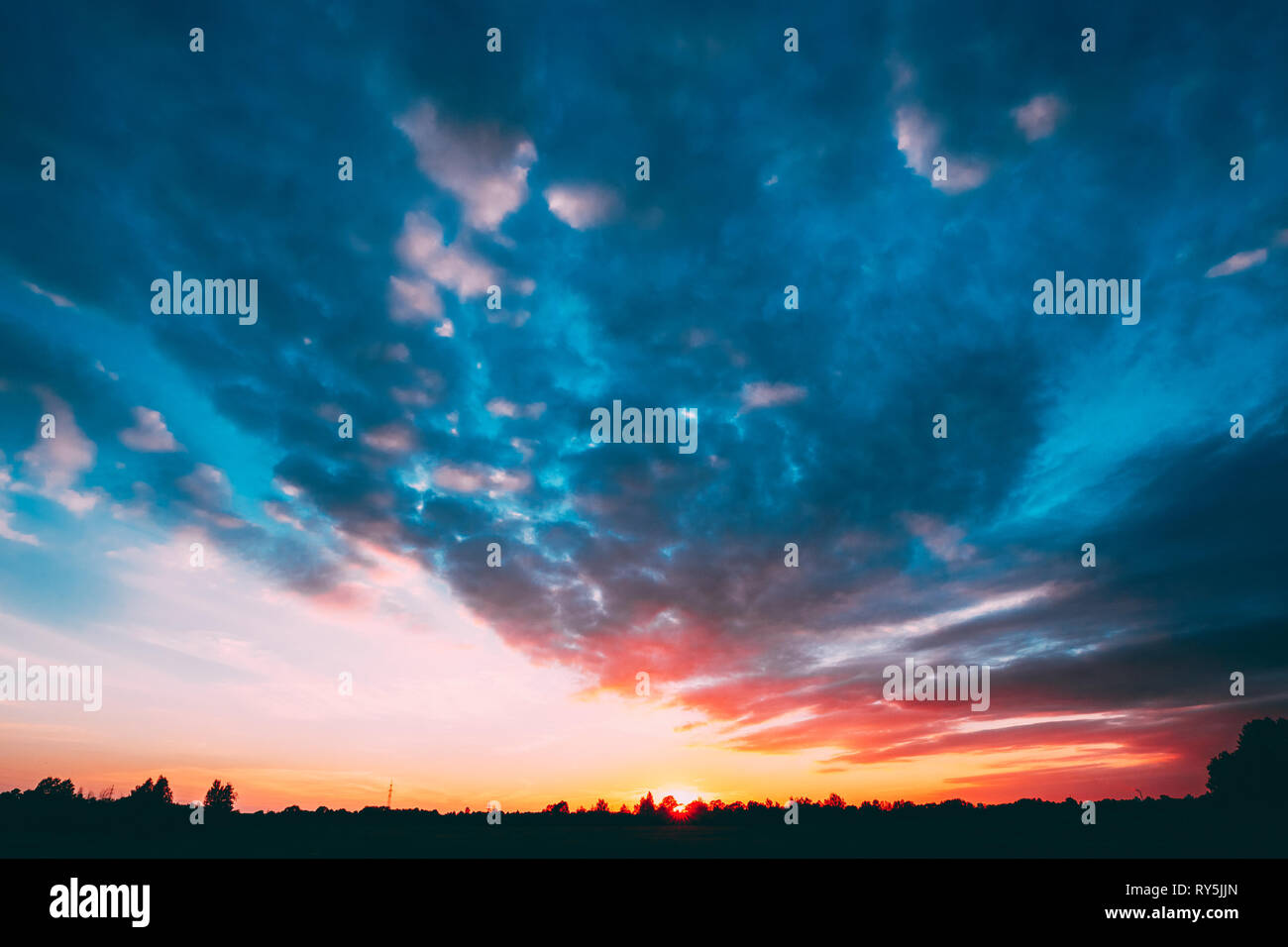 Beautiful dramatic sunrise over blue hi-res stock photography and ...