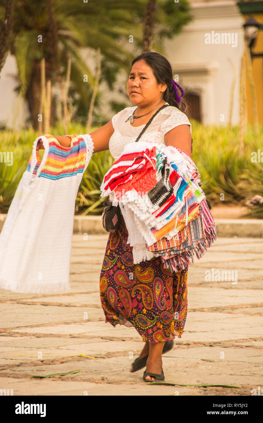 A Oaxacan woman selling dresses in the plaza, Oaxaca, Mexico Stock ...
