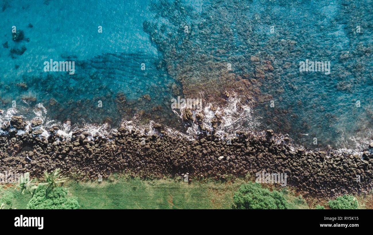 HAWAII, USA: drone view of rock beach in Maui Island. Blue water, green ...