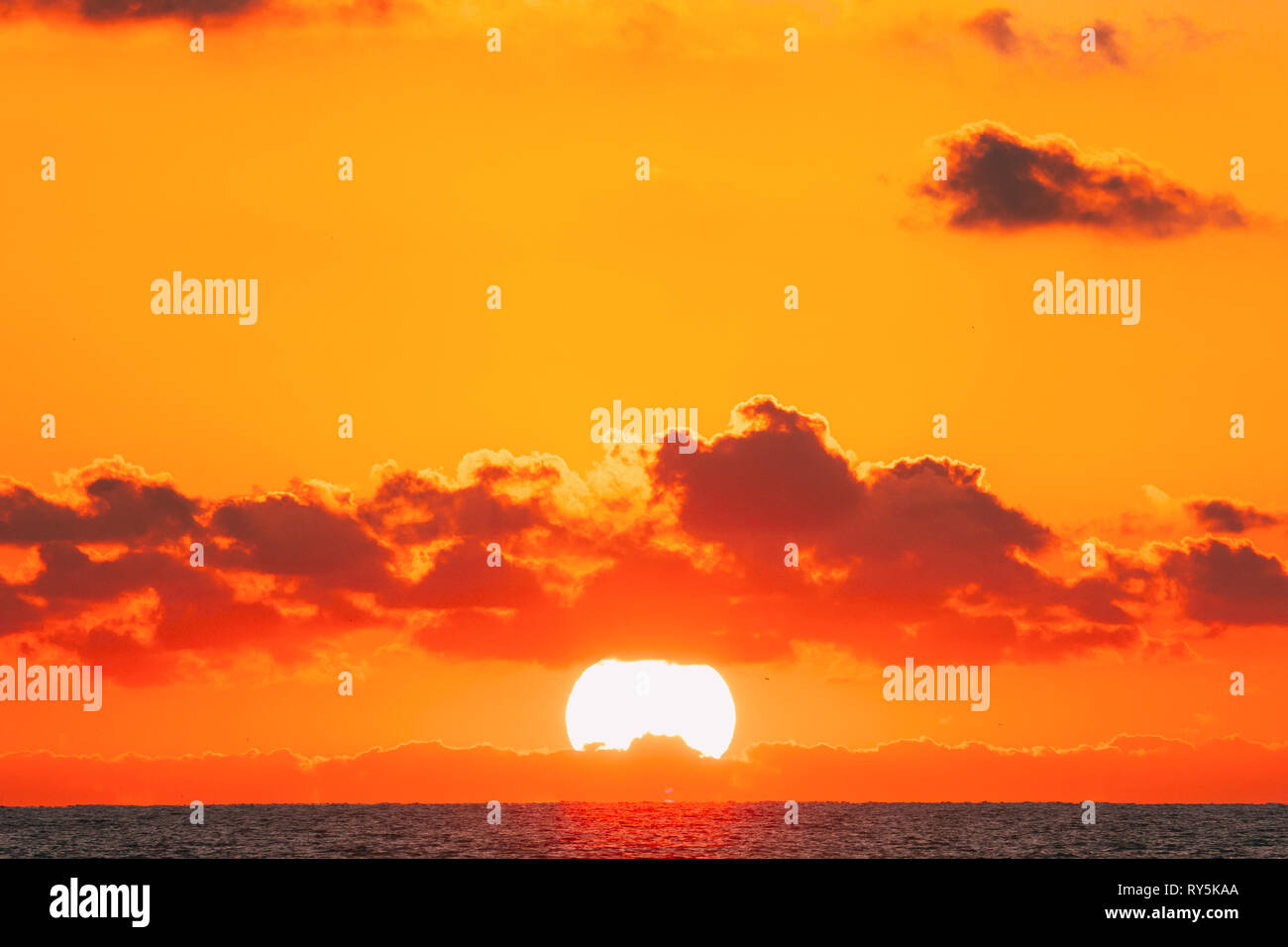 Sundown Over Sea Horizon At Sunset. Natural Sunrise Sky Warm Colors ...